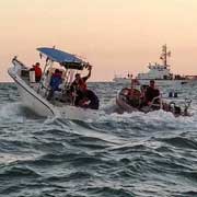 PHOTOS: U.S. Coast Guard Rescues Two After Boat Takes On Water 12 Miles ...